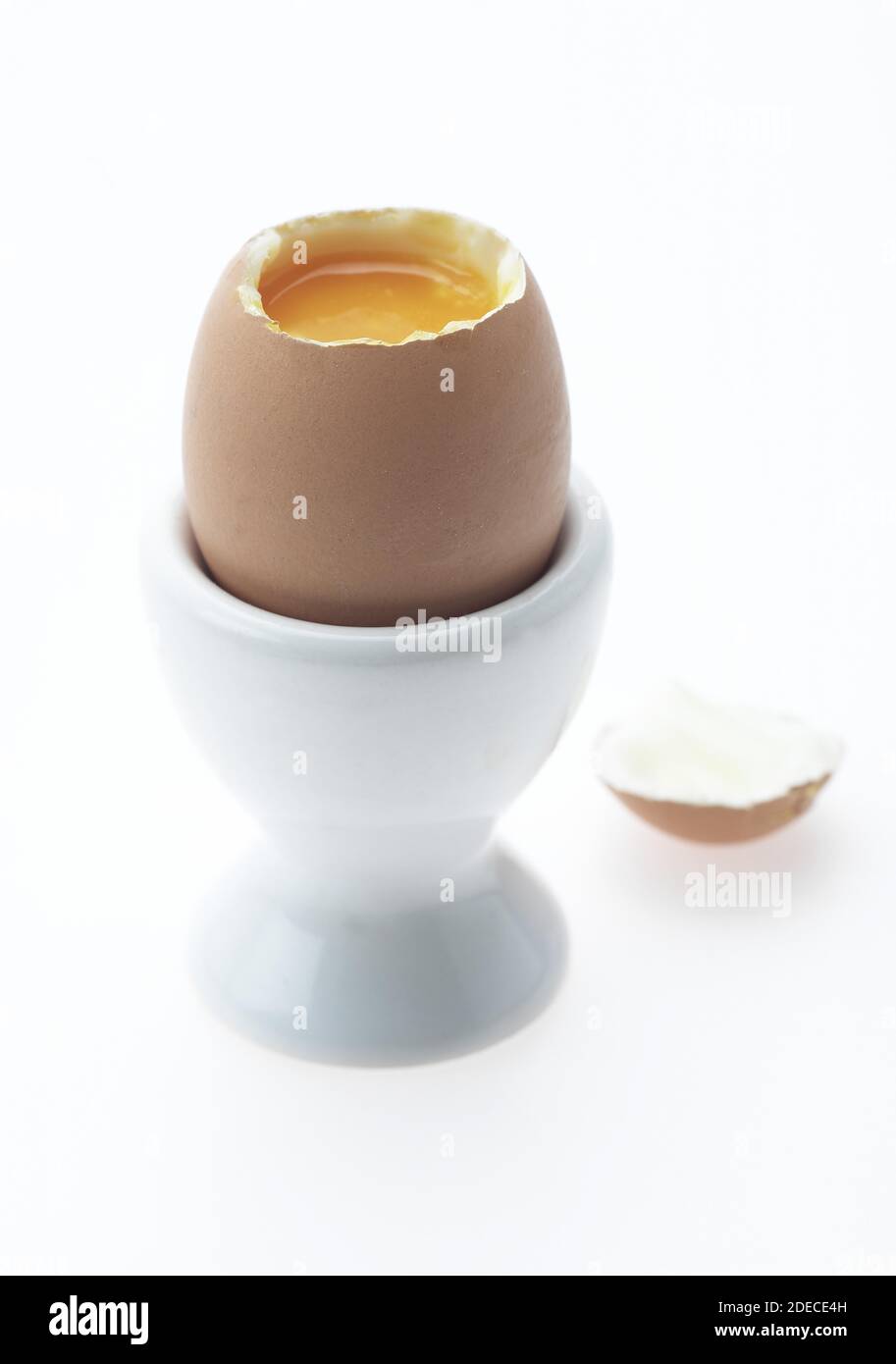 Soft-Boiled Chicken Egg in Eggcup against White Background Stock Photo ...
