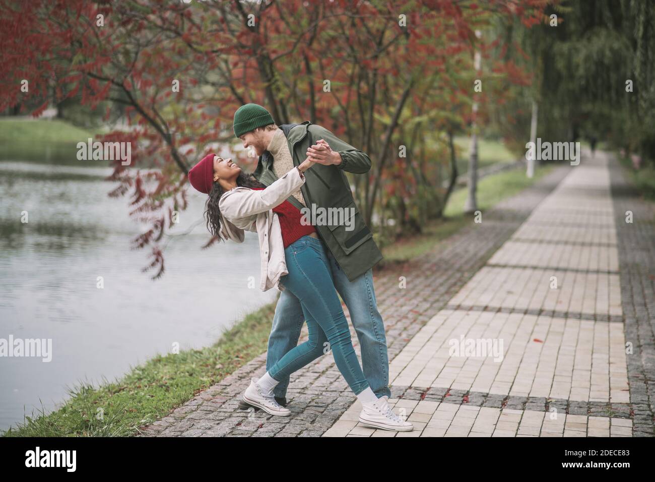 Couple dancing while having a date outdoor Stock Photo - Alamy