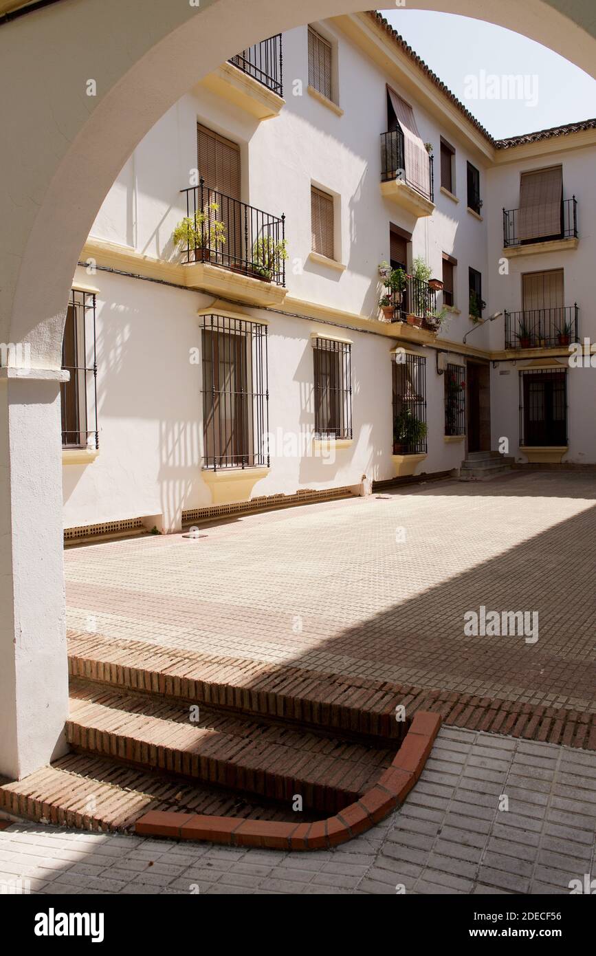 Courtyard with sunshine and shadows Stock Photo - Alamy