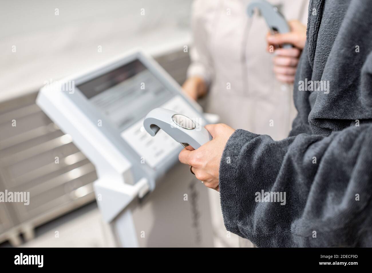 Woman measuring body composition balance, standing on the medical ...