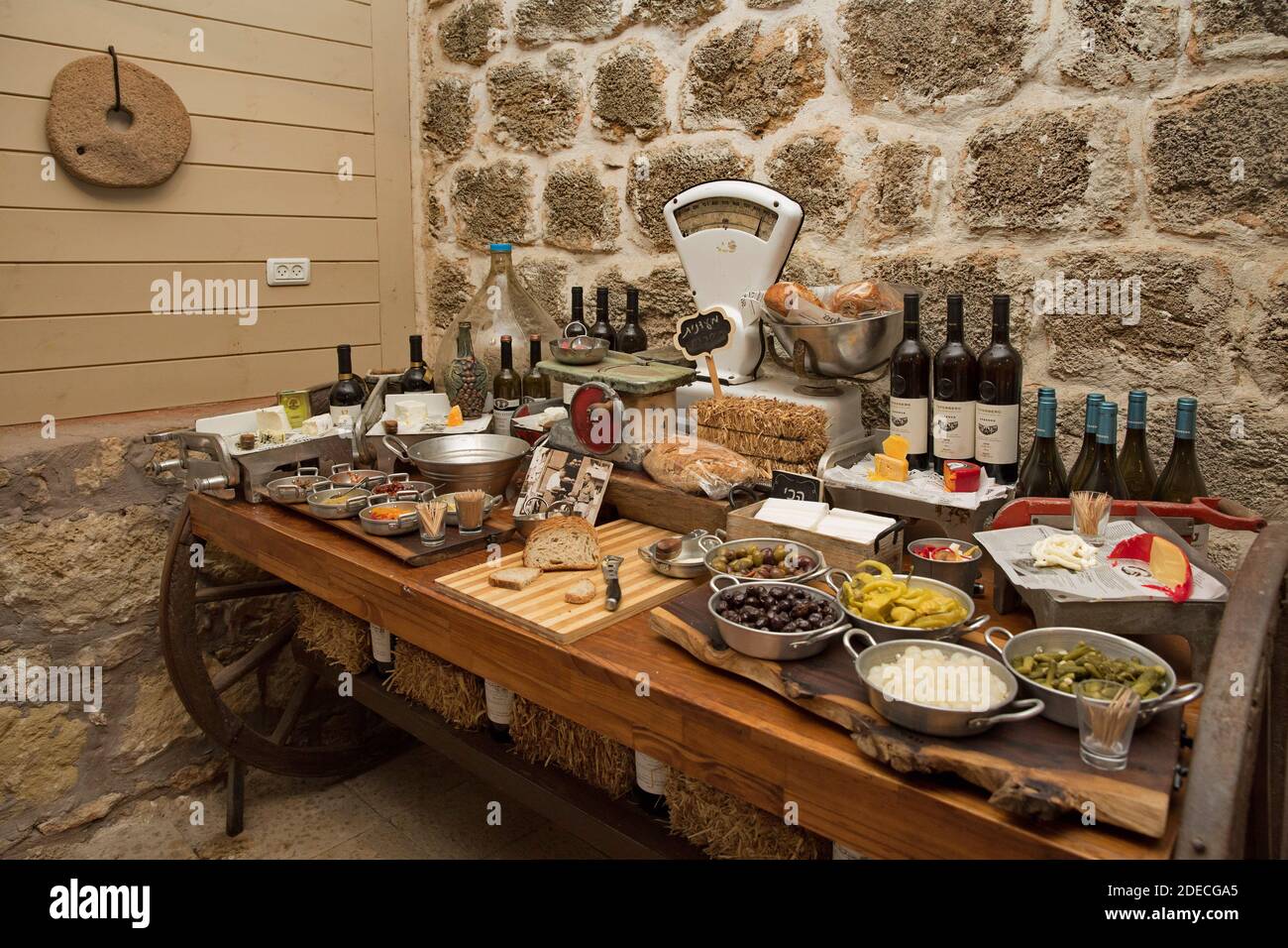 Rustic style buffet table laid out with an assortment of food at an ...