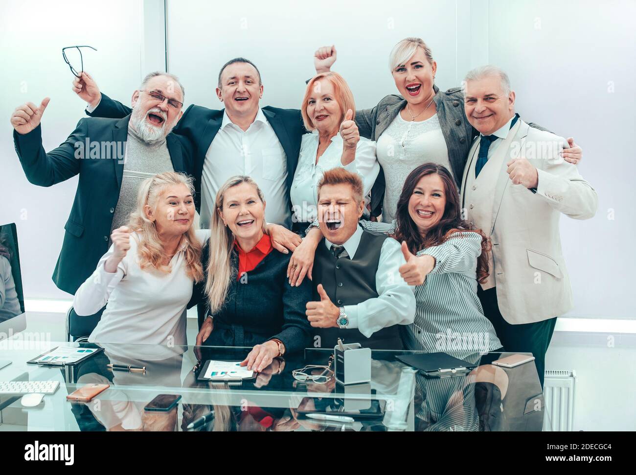large group of experienced employees in the workplace in the office ...