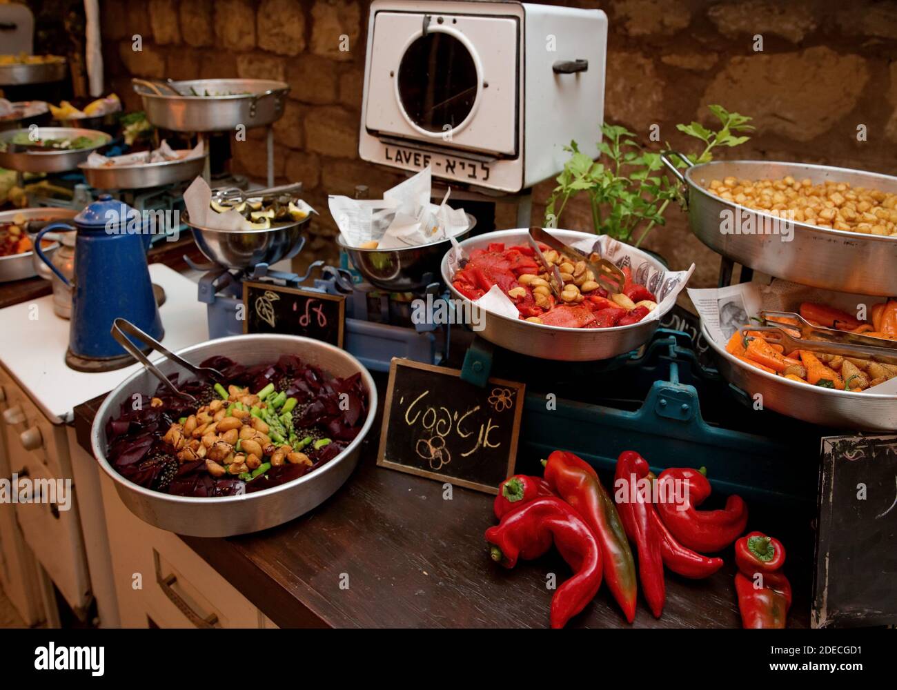 Rustic style buffet table laid out with an assortment of food at an ...