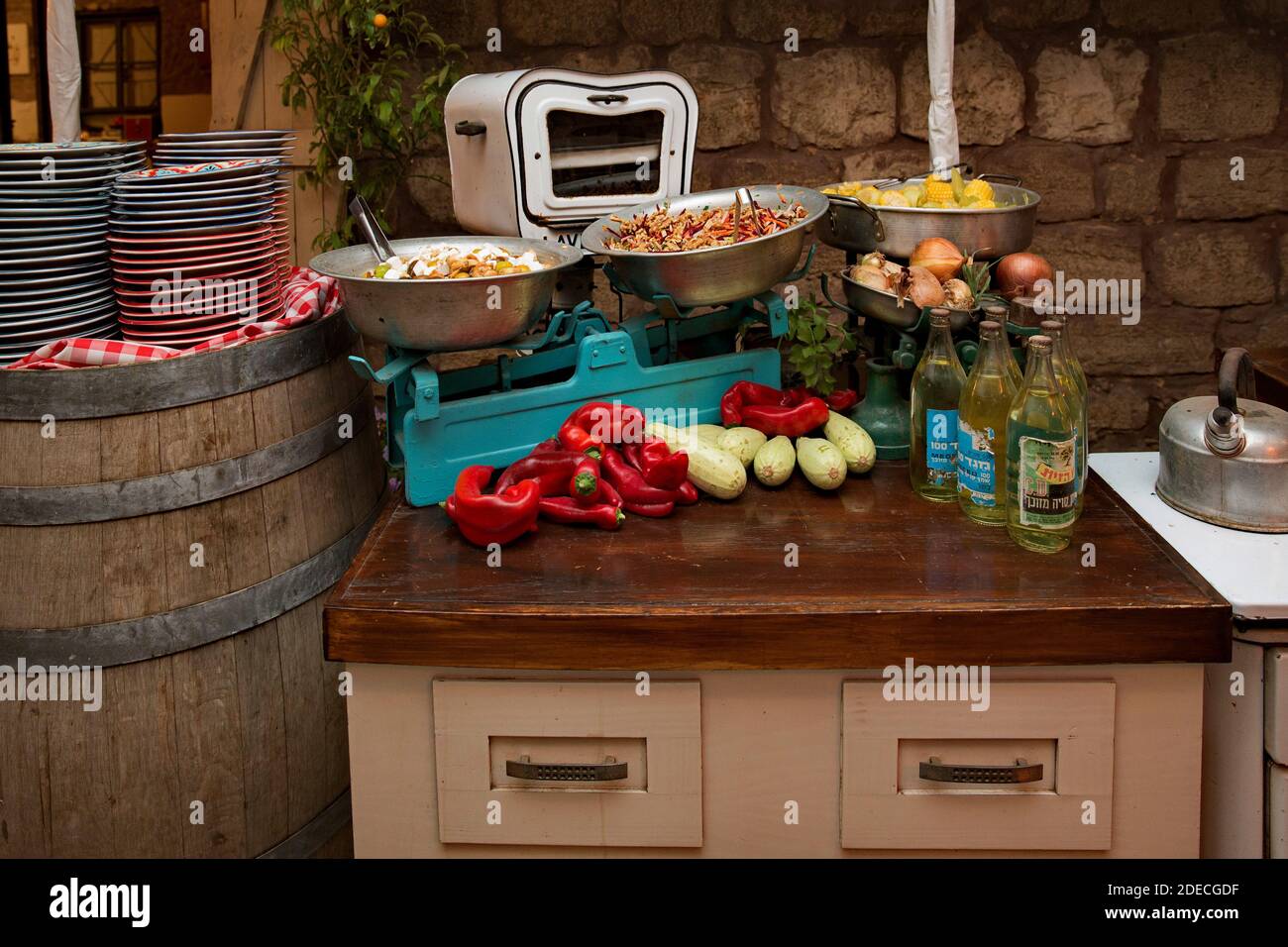 Rustic style buffet table laid out with an assortment of food at an ...