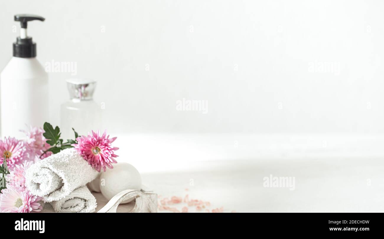 Spa background with products for personal hygiene and beauty with pink ...