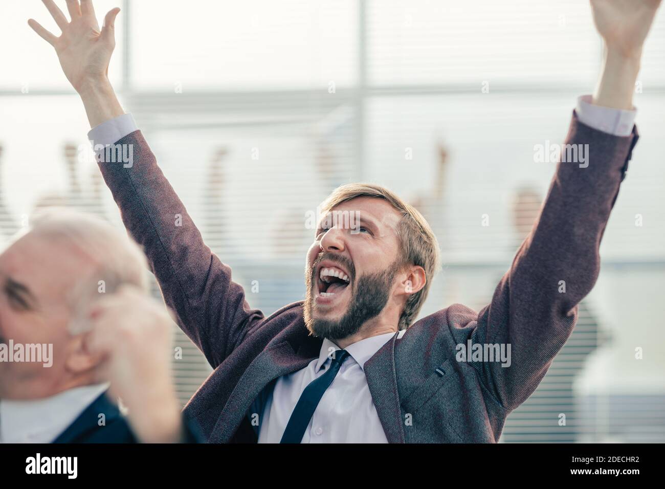 close up. jubilant colleagues standing in the office Stock Photo - Alamy