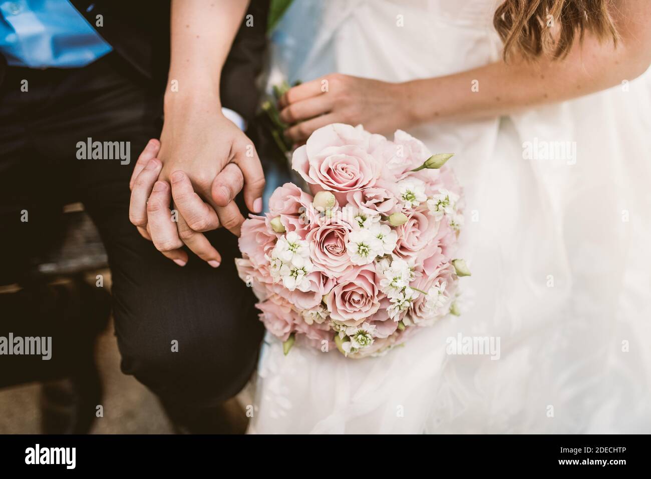 Wedding couple bride and groom holding hands Stock Photo - Alamy