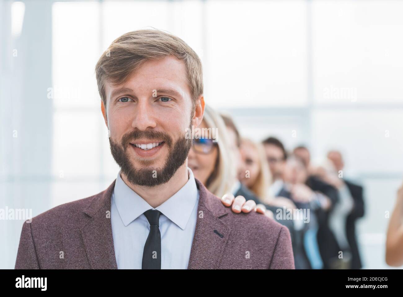 close up. big business team supporting their leader Stock Photo - Alamy