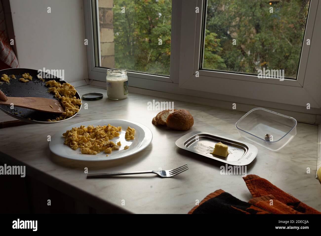 Omelet in plate for breakfast table by window Stock Photo - Alamy