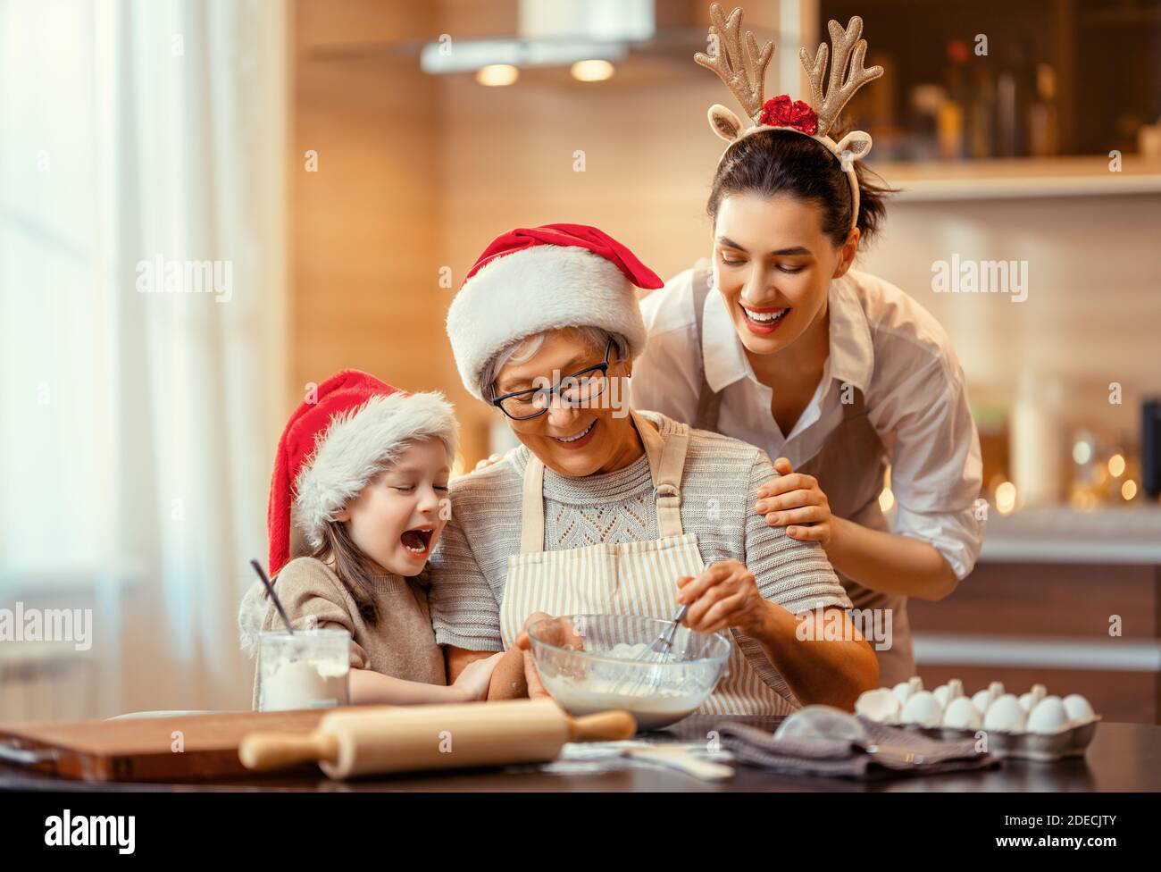 Merry Christmas and Happy Holidays. Family preparation holiday food ...