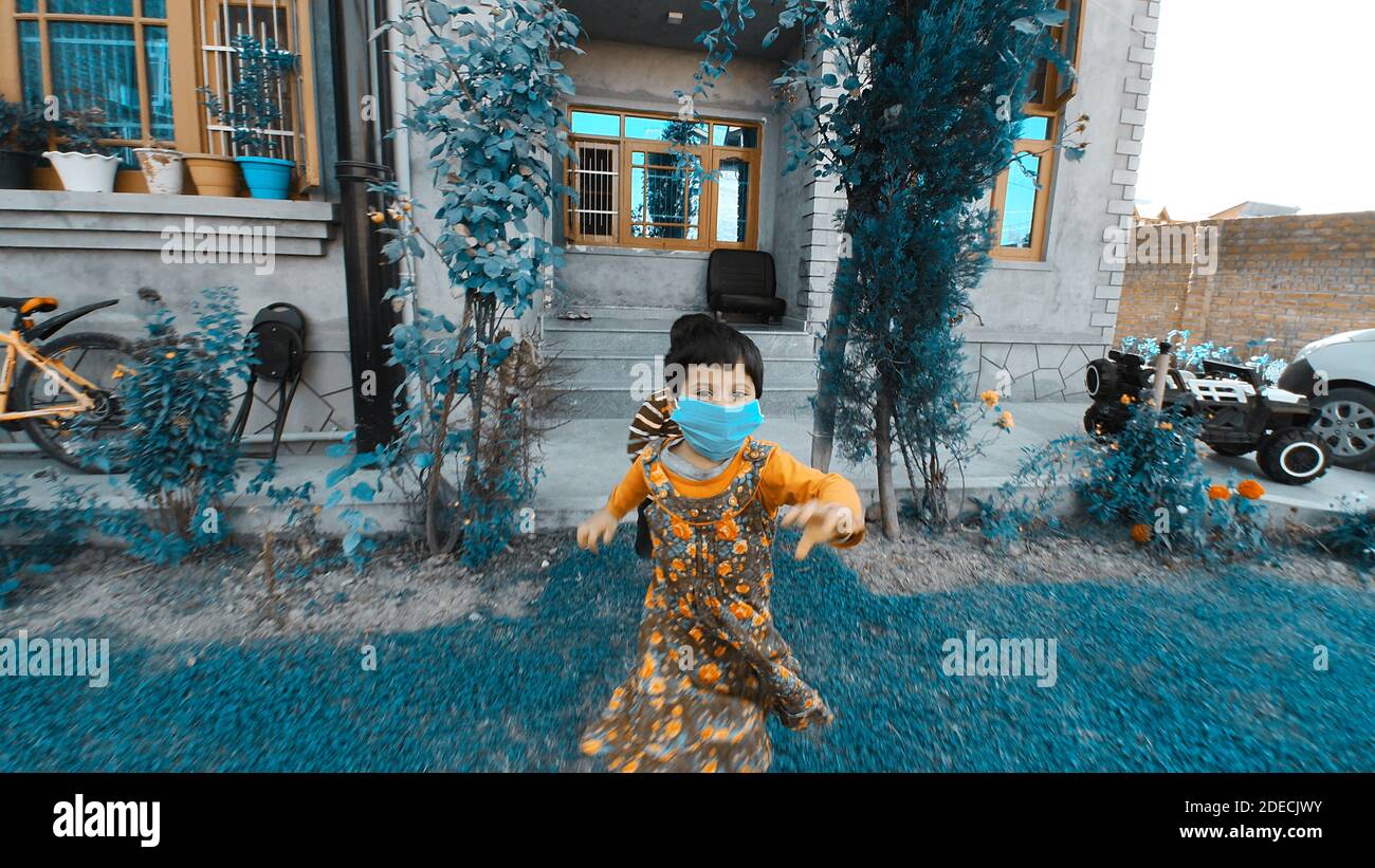 Children masked playing enjoying crying and smiling in park during ...