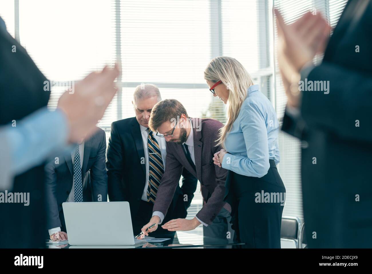 close up. working group standing near the office Desk Stock Photo - Alamy