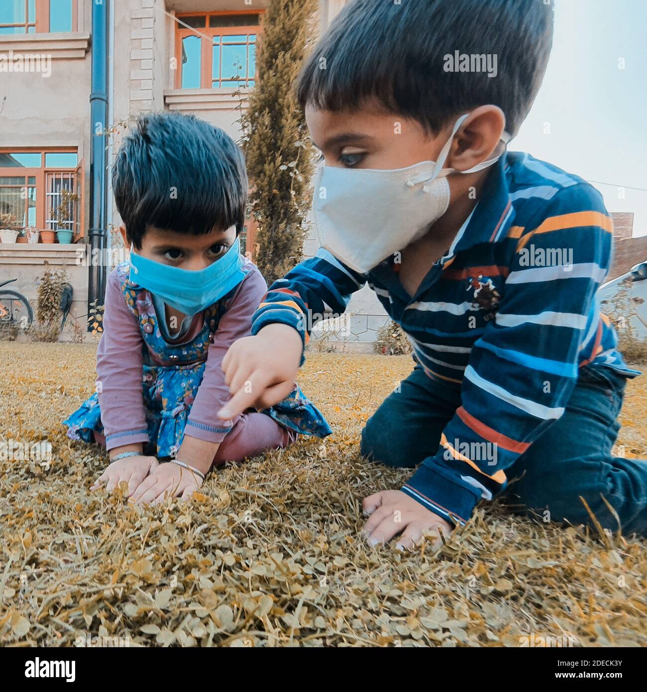 Children masked playing enjoying crying and smiling in park during ...