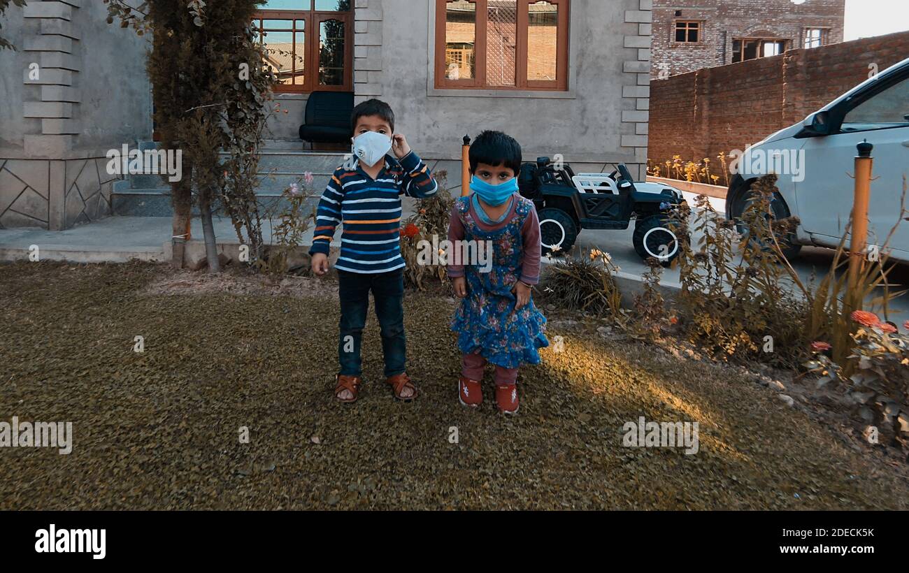 Children masked playing enjoying crying and smiling in park during ...
