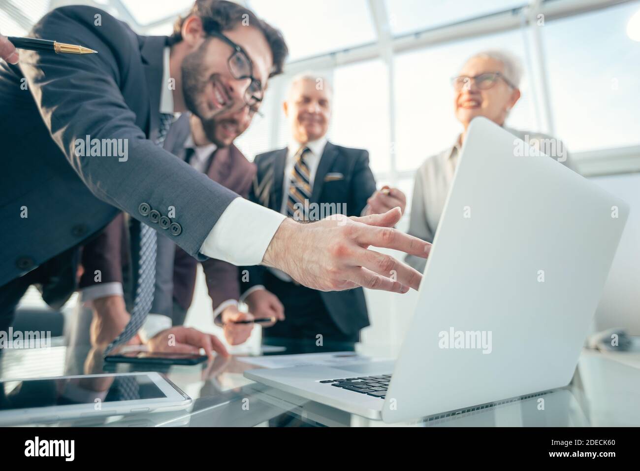 close up. happy employees looking at the laptop screen Stock Photo - Alamy