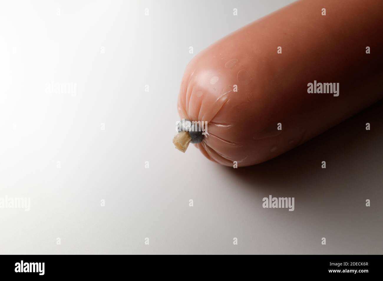 Sausages made from fish meat on a white background Stock Photo - Alamy