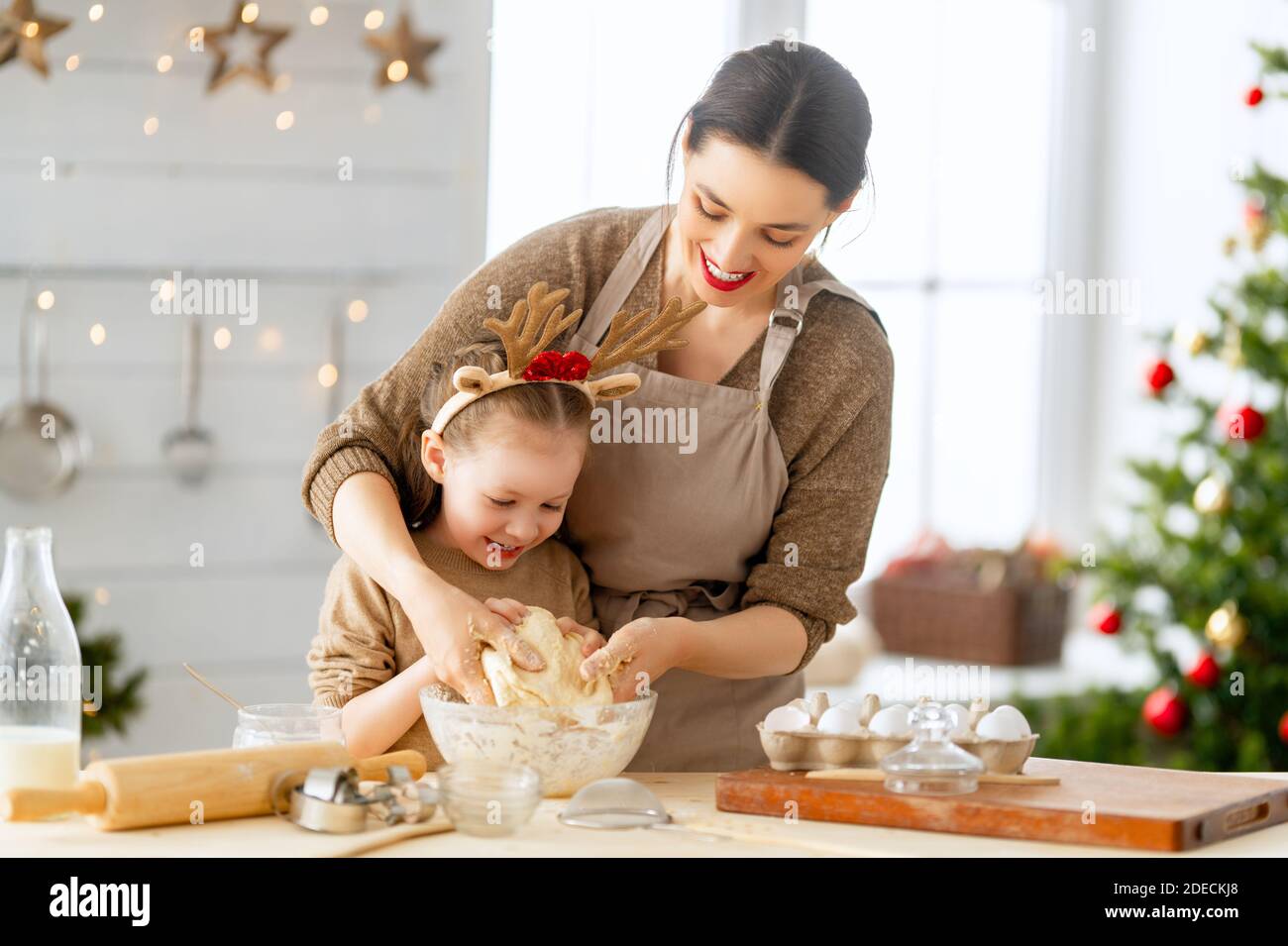 Merry Christmas and Happy Holidays. Family preparation holiday food ...