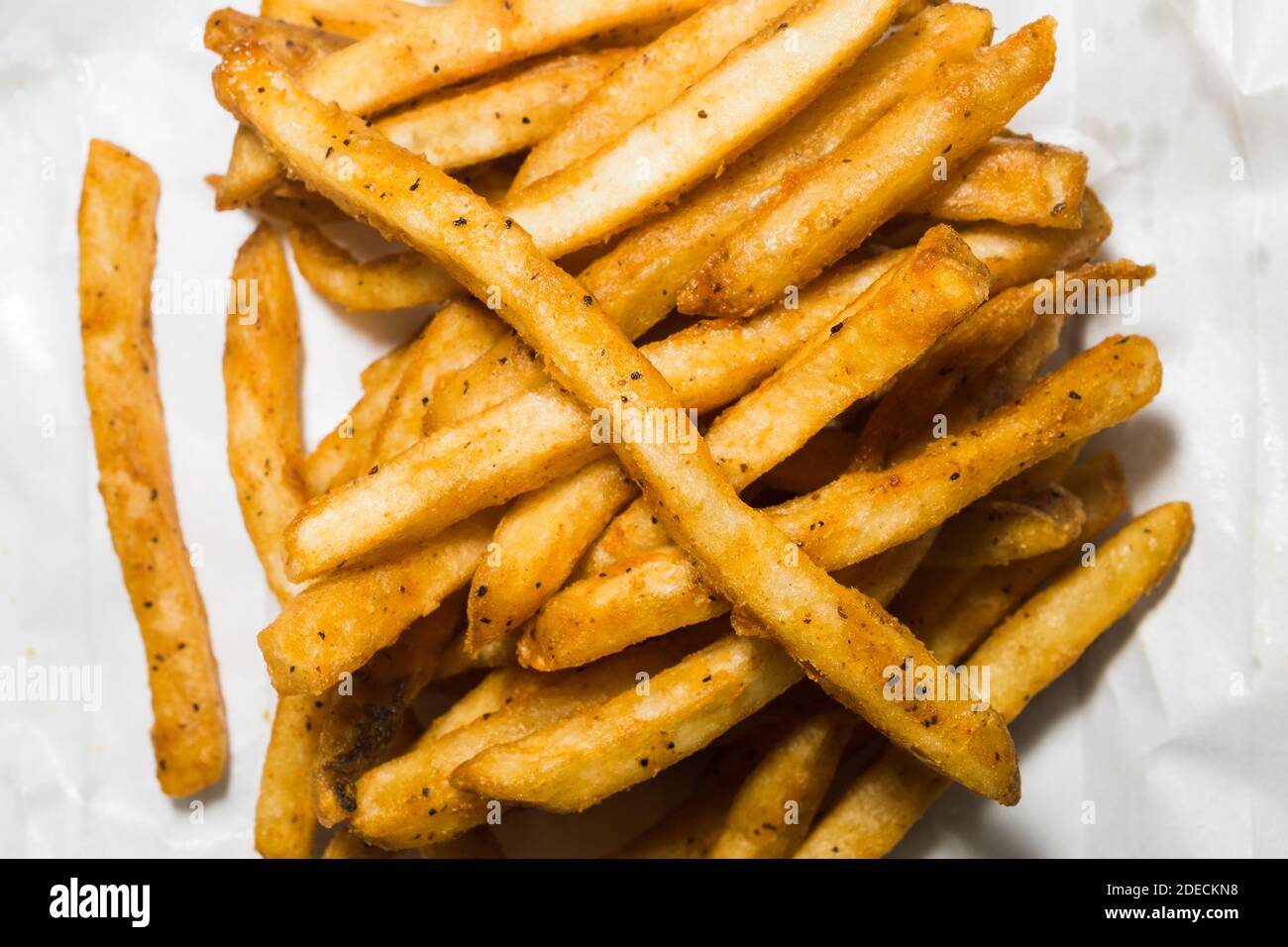 Delicious French Fries with Seasoning Stock Photo - Alamy
