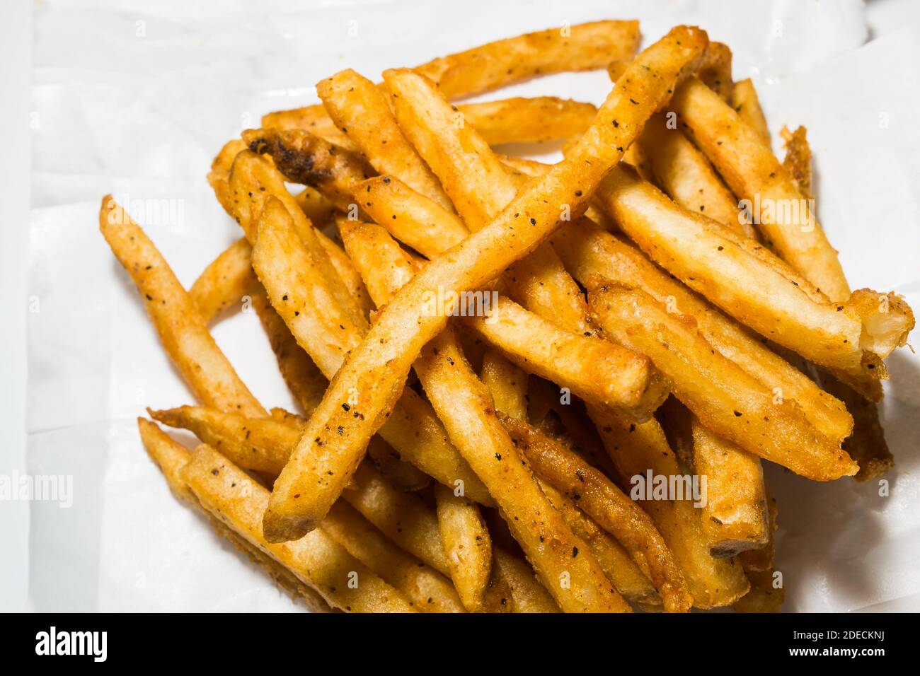 Delicious French Fries with Seasoning Stock Photo - Alamy