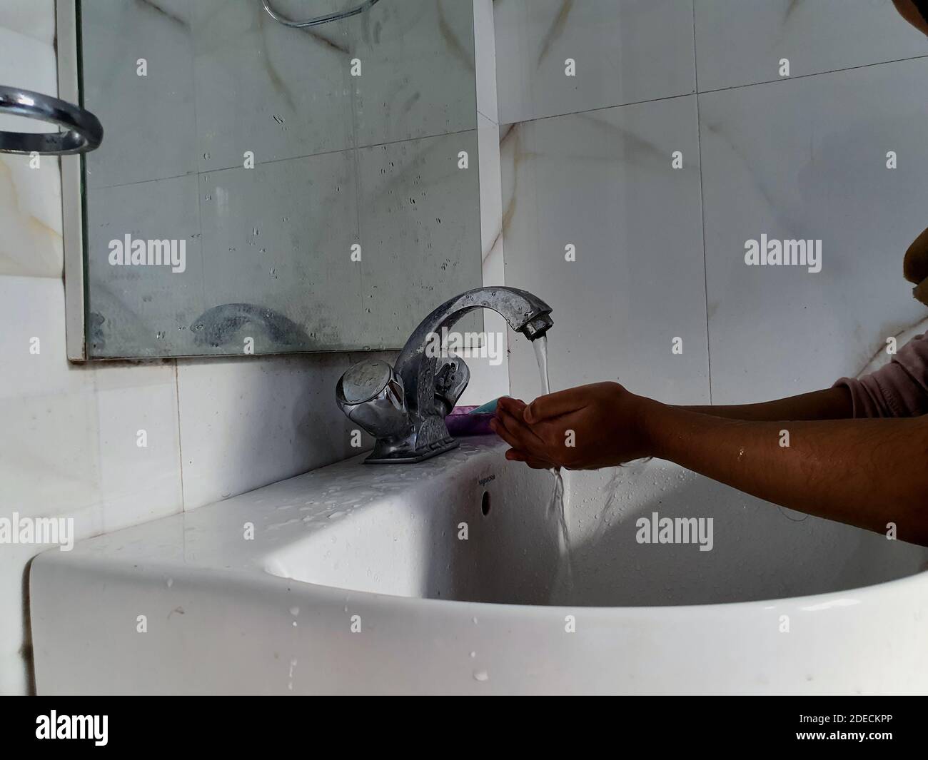 Washing hands in bathroom by masked Children during coronavirus ...