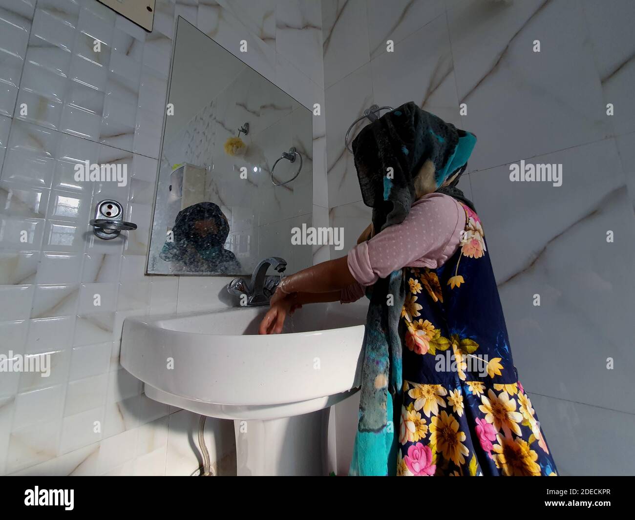 Washing hands in bathroom by masked Children during coronavirus ...