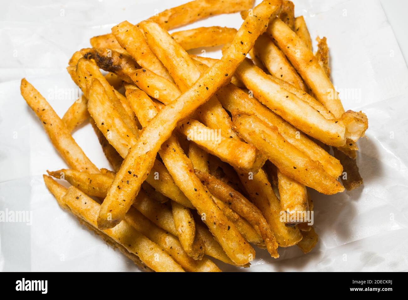 Delicious French Fries with Seasoning Stock Photo - Alamy