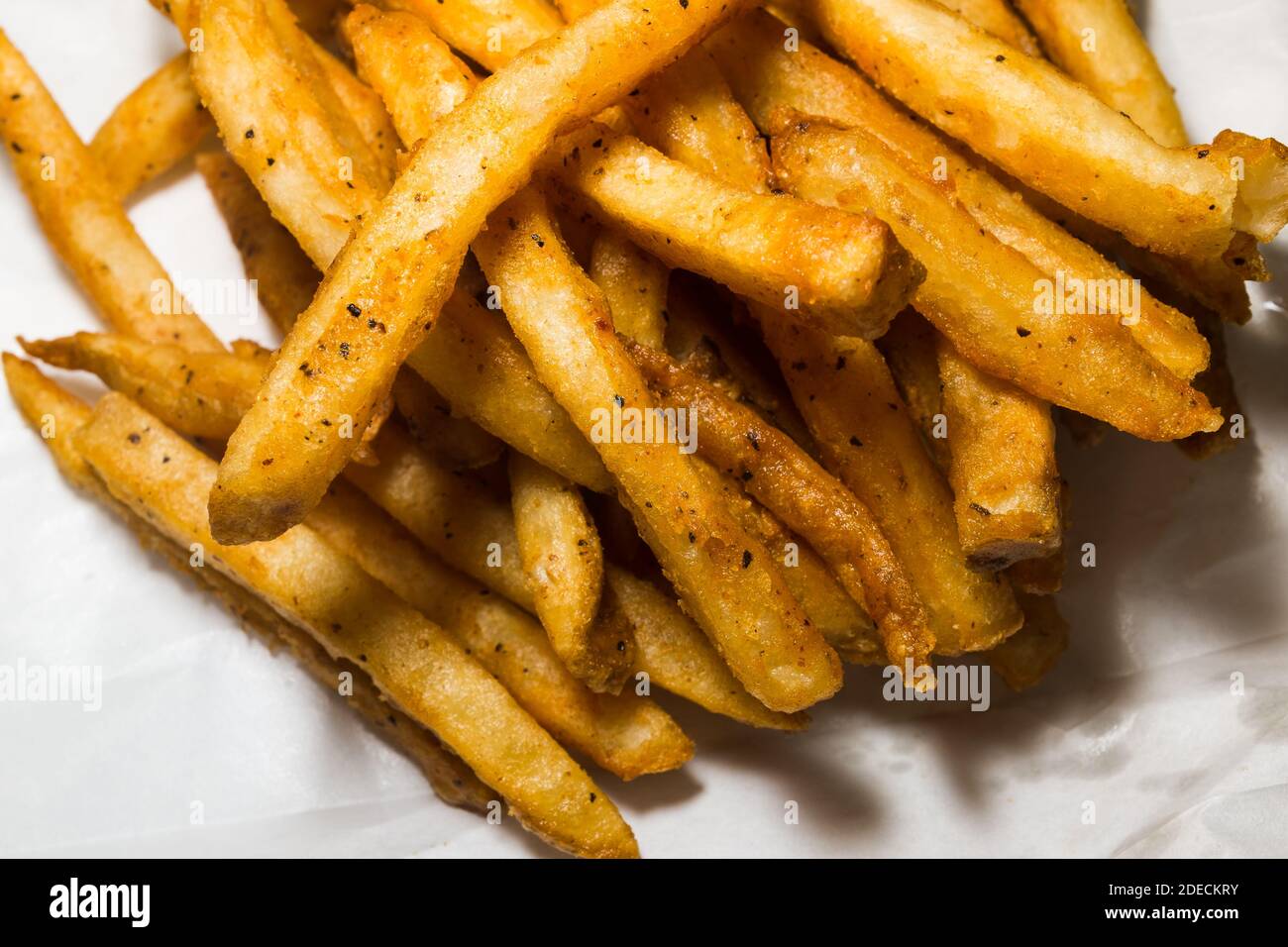Delicious French Fries with Seasoning Stock Photo - Alamy