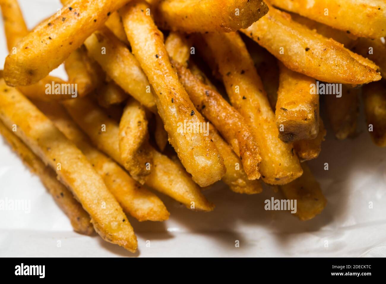 Delicious French Fries with Seasoning Stock Photo - Alamy