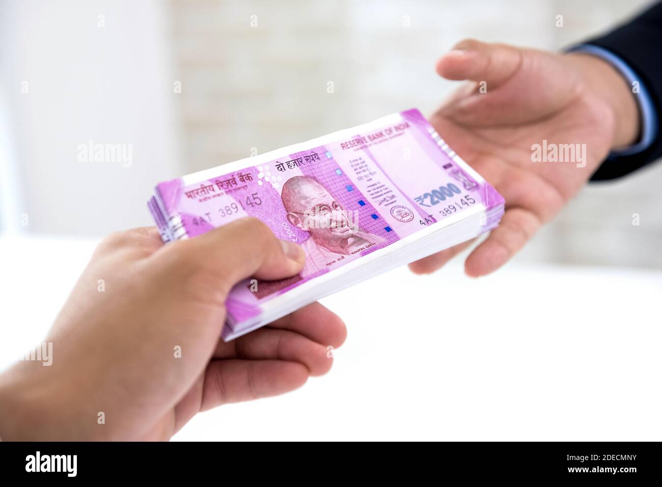 Handing over money hi-res stock photography and images - Alamy