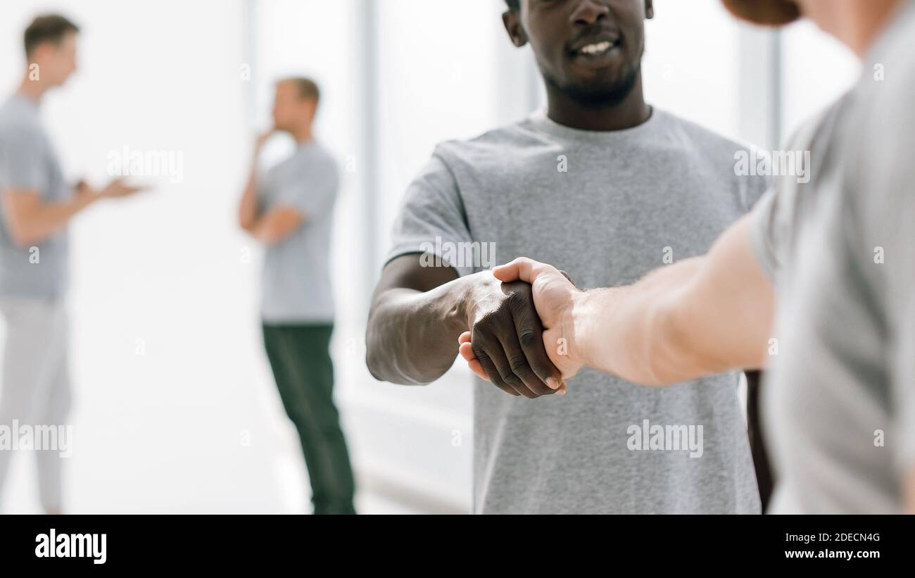 close up. friendly handshake of young people Stock Photo - Alamy