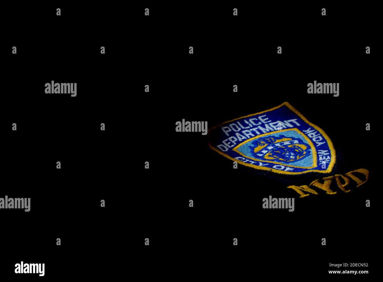 Logo and badge of the New York police department on a cloth shirt ...