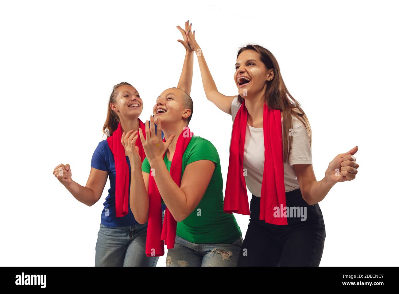 Togetherness. Female soccer fans cheering for favourite team with ...
