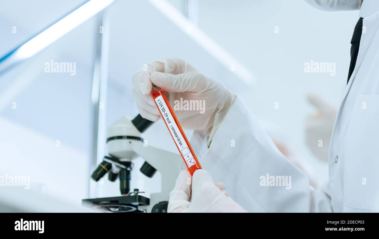 close up. laboratory employee sitting at the laboratory table Stock ...