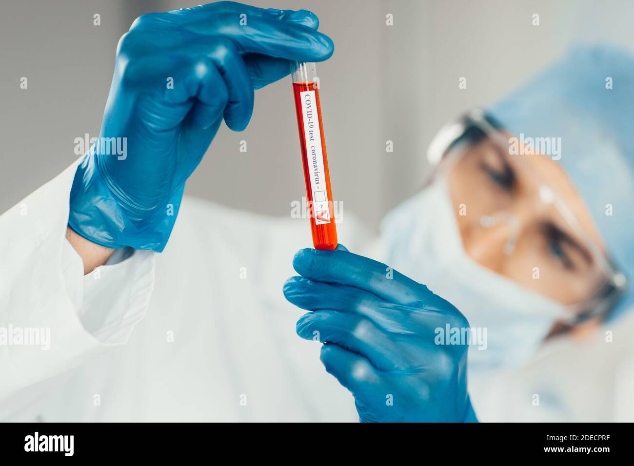 close up. test tube in the hands of a laboratory assistant Stock Photo ...