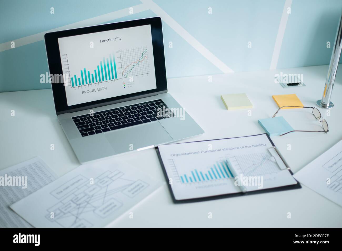 laptop,financial charts and marketing charts on the office Desk Stock ...