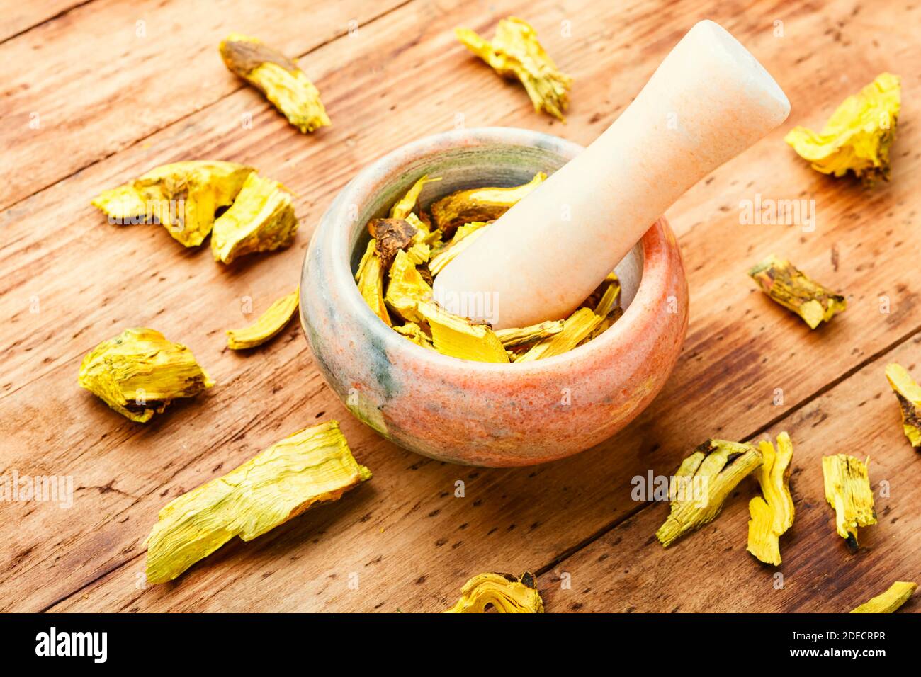 Barberry root in a ceramic mortar and pestle Stock Photo - Alamy
