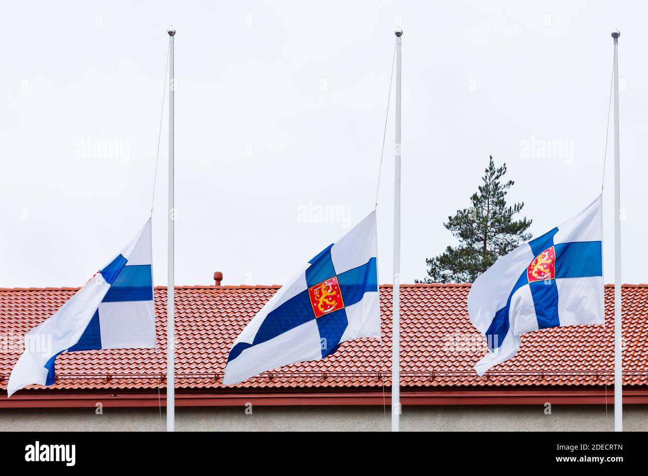 Three finnish flags lowered to half mast on the occasion of mourning at ...