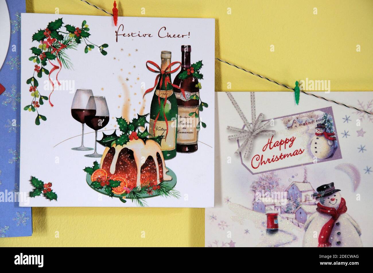 Christmas cards hanging on a string in a house Stock Photo - Alamy