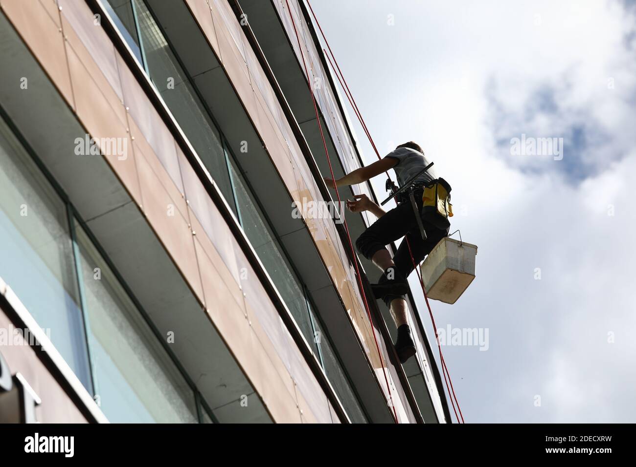 Window cleaning by climber on high-rise building Stock Photo - Alamy