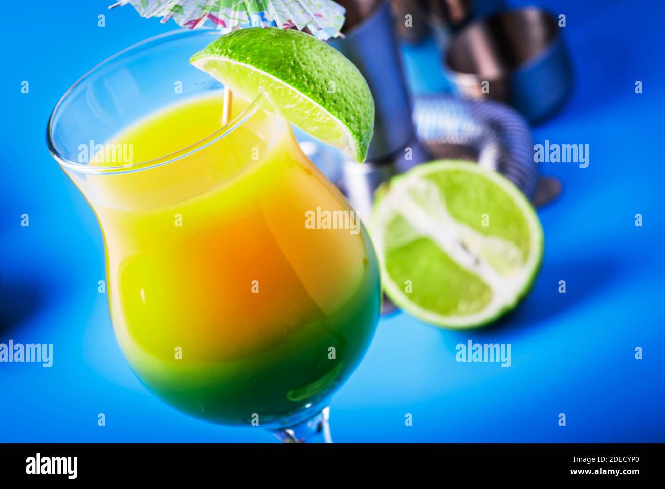 Double layer green yellow alcoholic cocktail with mango juice, rum ...