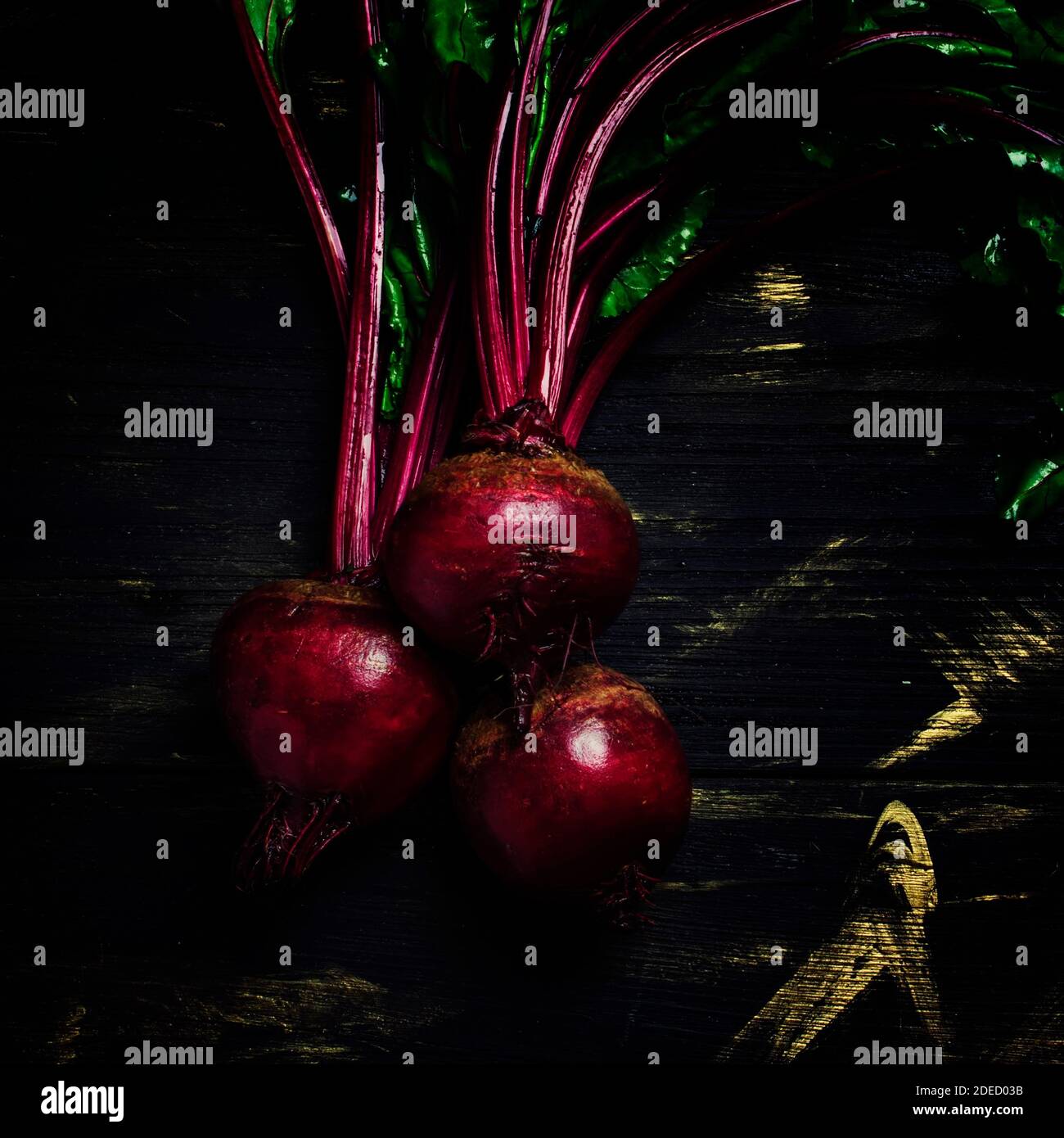 Fresh beet with tops, dark background, low key, top view Stock Photo ...