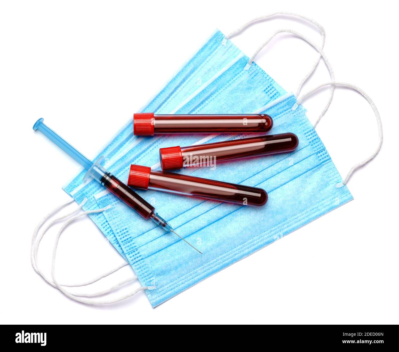 Blood test tube with syringe, medical mask on white background, top ...