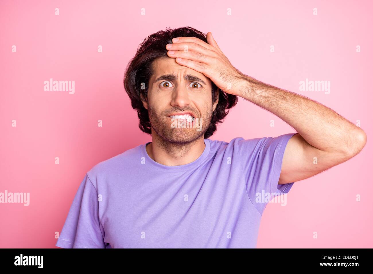 Photo of young man upset stressed depressed bite lips hand cover ...