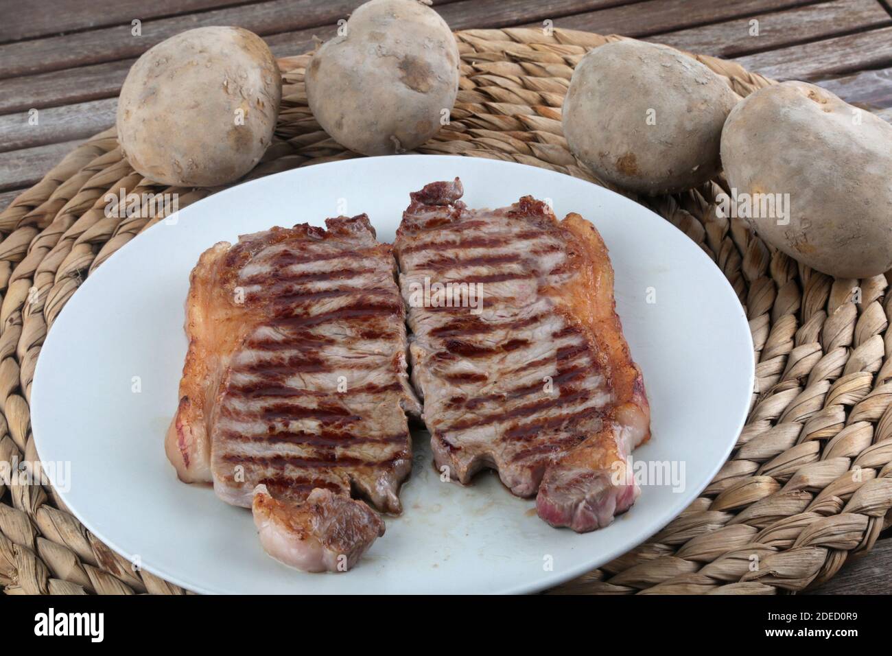 piece of meet cooked at the barbecue Stock Photo - Alamy