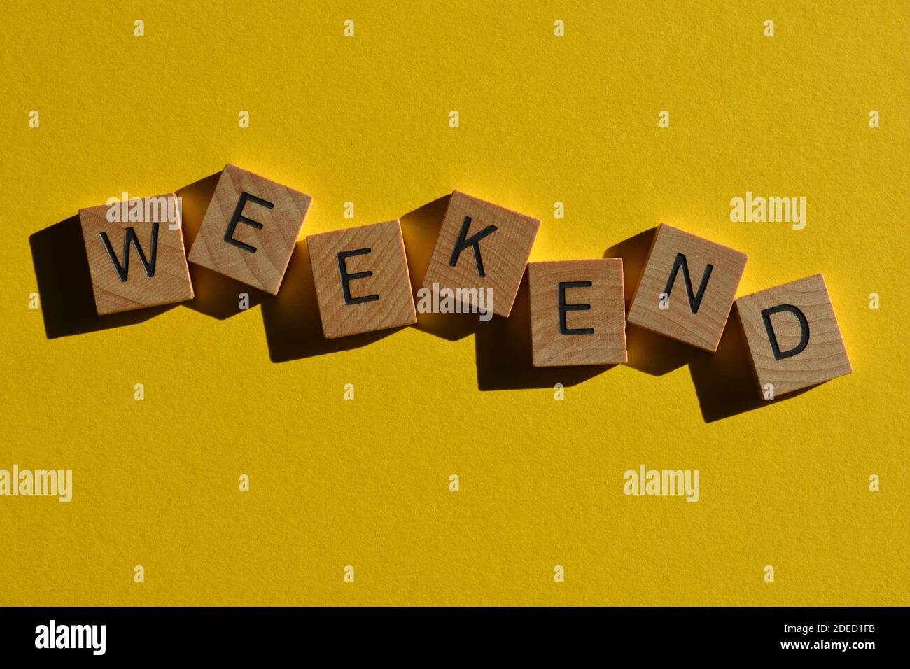 Weekend, word in wooden alphabet letters isolated on bright yellow ...