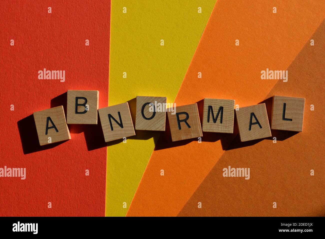 Abnormal, word in wooden alphabet letters isolated on colourful ...