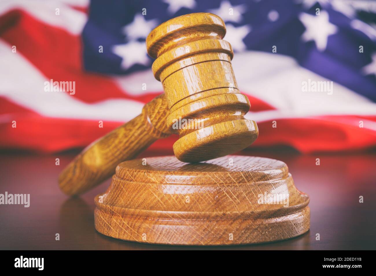 Judges wooden gavel with USA flag in the background Stock Photo - Alamy