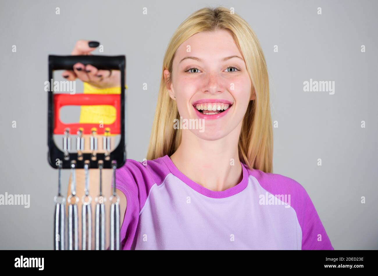 Woman exercising chest expander hi-res stock photography and images - Alamy