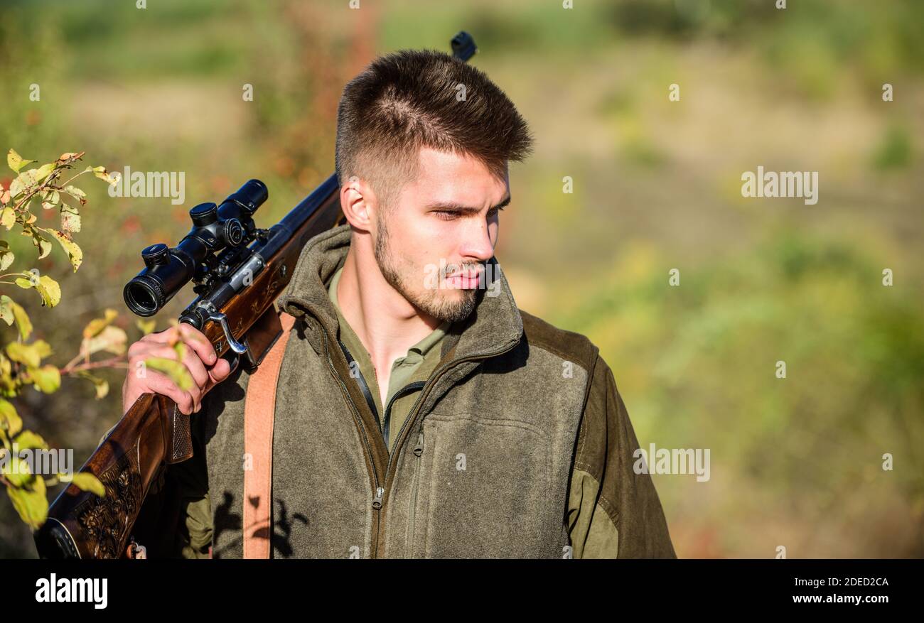 Man hunter with rifle gun. Boot camp. Hunting skills and weapon ...