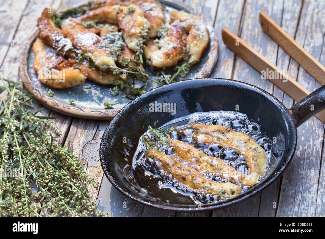 common mugwort, common wormwood (Artemisia vulgaris), home-baked small ...